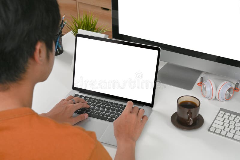 Young Man Working with Laptop Computer at White Office Desk. Stock ...