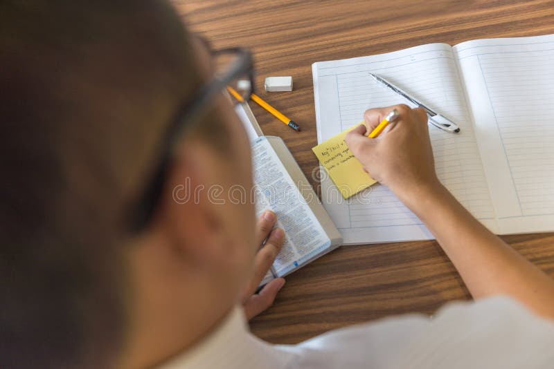 Rear View of Young Student Writing Note Stock Photo - Image of lesson ...