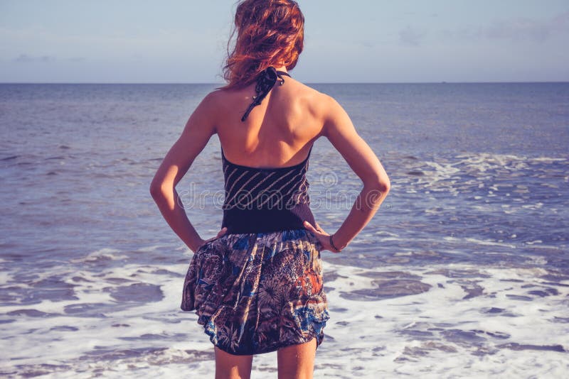Rear View of Young Woman Standing on Beach Looking at Sea Stock Image ...