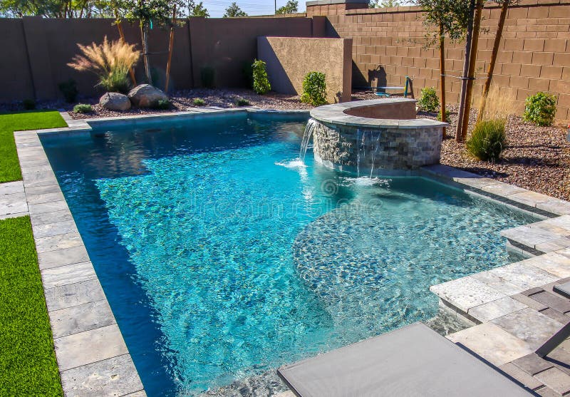 Rear Yard Swimming Pool with Waterfall Stock Image - Image of boulders ...