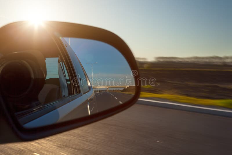 Rearview Mirror and the Setting Sun from Car Stock Photo - Image of ...