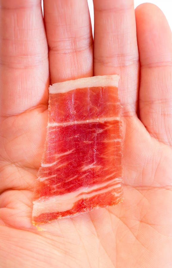 Rebanada Y Mano Del Jamón De Serrano Foto de archivo - Imagen de ...