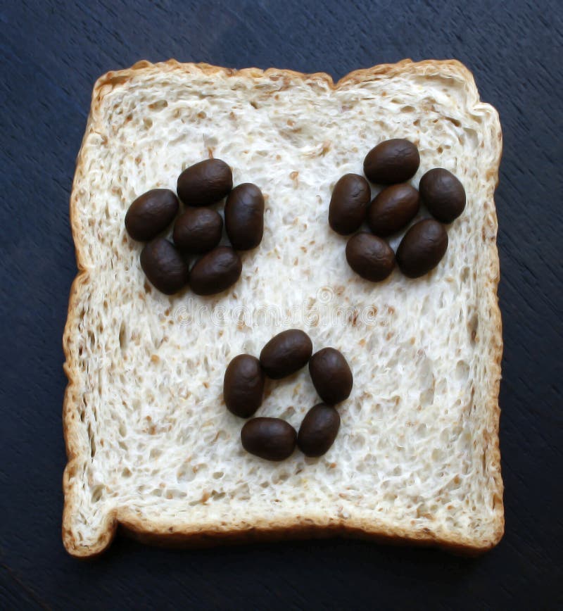 Rebanadas Del Pan Con La Cara Imagen de archivo - Imagen de textura ...