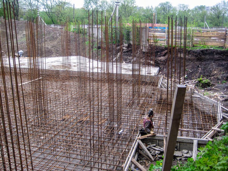Rebar Frameworks and Concrete Foundation Show the Early Stages of ...