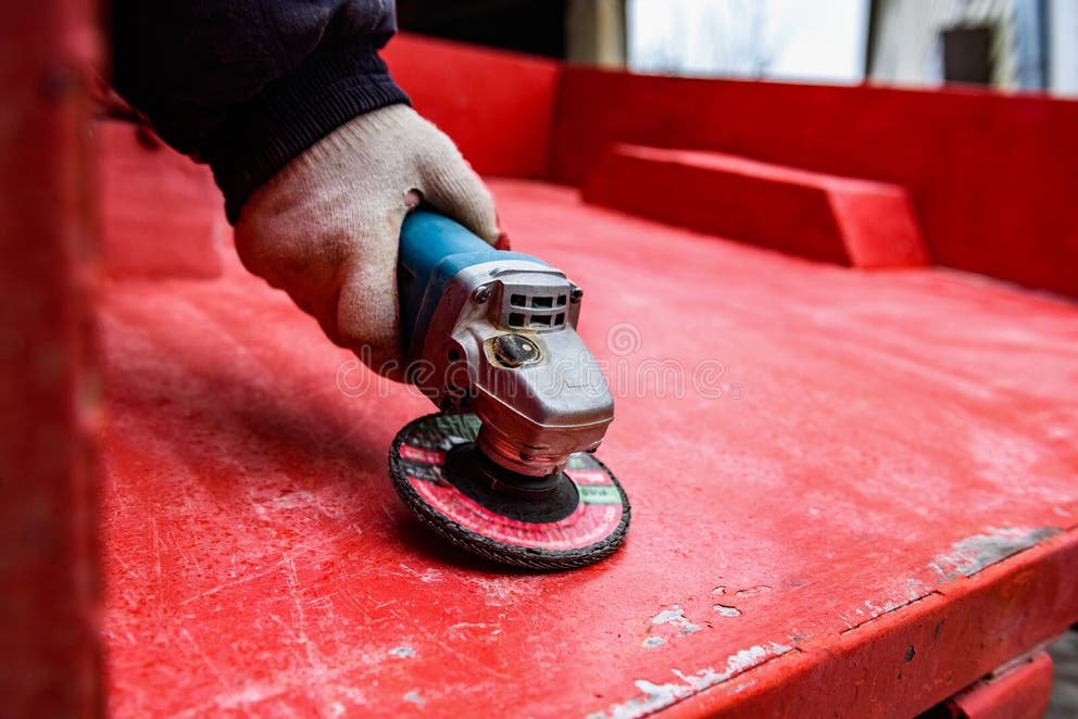 Rebuilding Upgrading and Modifying Trailer. Man Grinding Old Paint from Trailer. Stock Photo ...