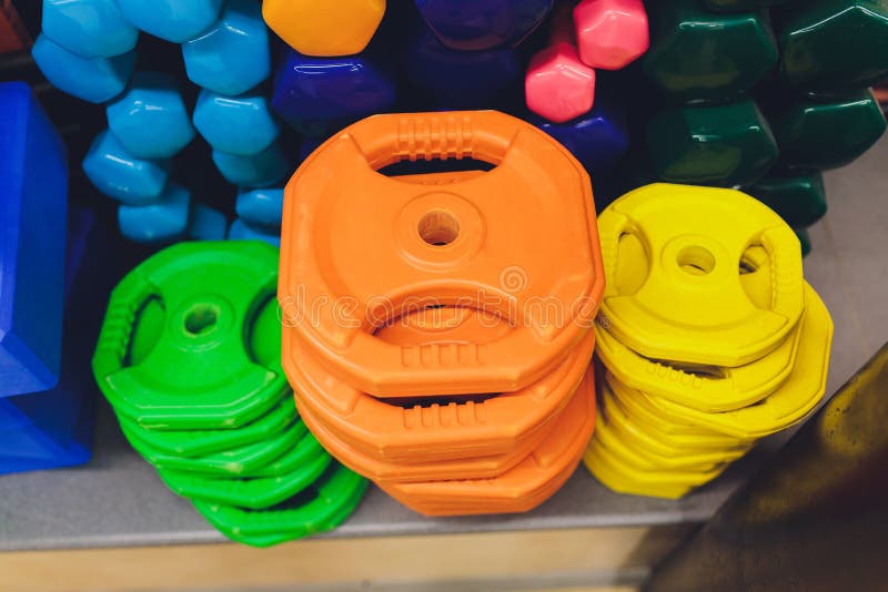 Receding Row of Weights Lined Up in a Gym Waiting for Clients with ...