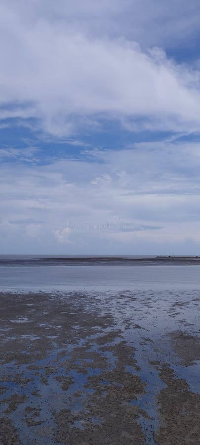 The Receding Sea Reveals Rocks Stock Image - Image of reveals, rocks ...