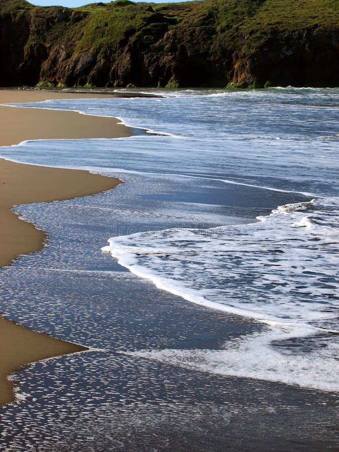 Receding wave on beach stock photo. Image of background - 4603704