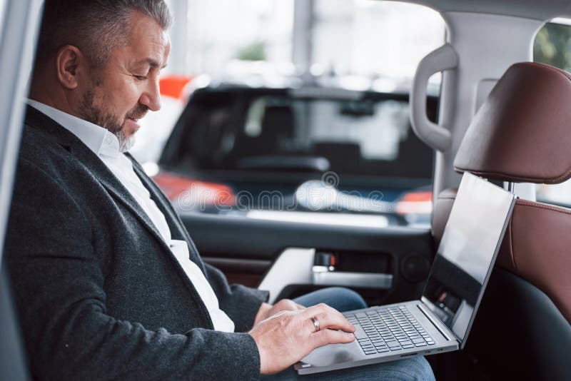 Received Nice Mail. Working on a Back of Car Using Silver Colored ...