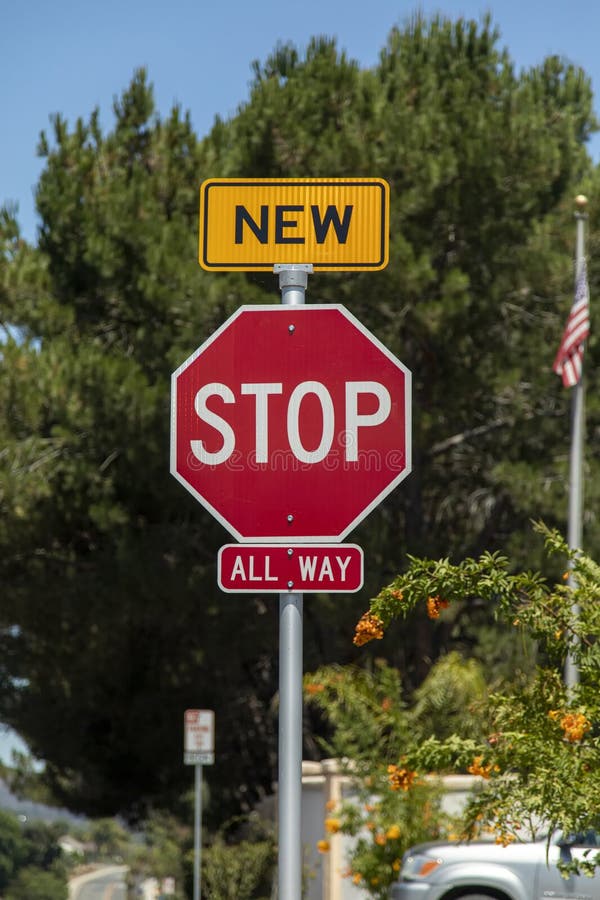 A Recently Installed Stop Sign with a Small Sign in Yellow with the ...