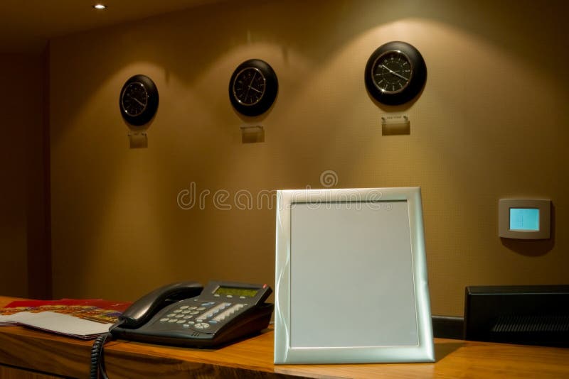 Reception Desk with Phone and Row of Clock Stock Image - Image of ...