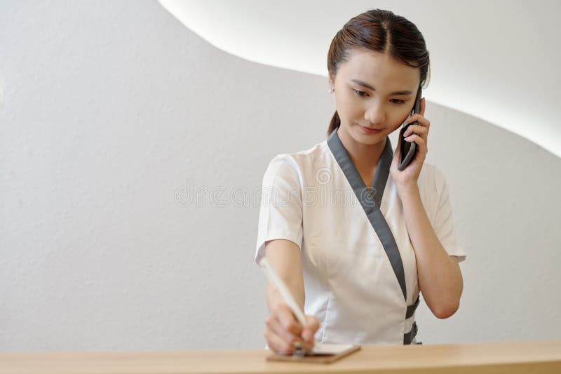Receptionist Answering Phone Call Stock Photo - Image of call, accept ...