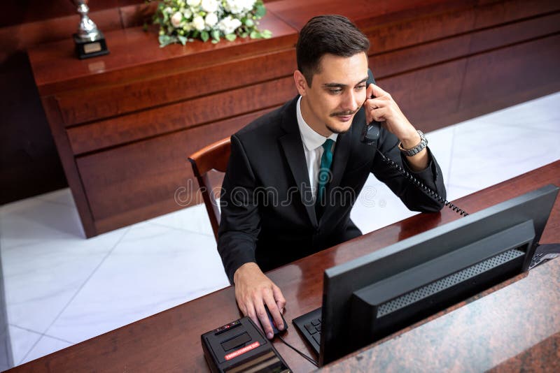 Receptionist in Black Suit Sitting and Working Stock Photo - Image of ...