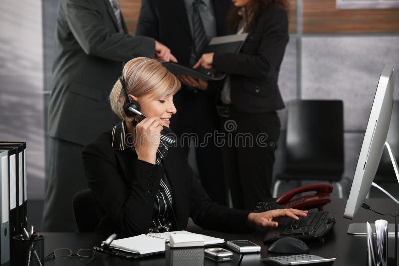 Receptionist Receiving Phone Calls Stock Image - Image of businesswomen ...