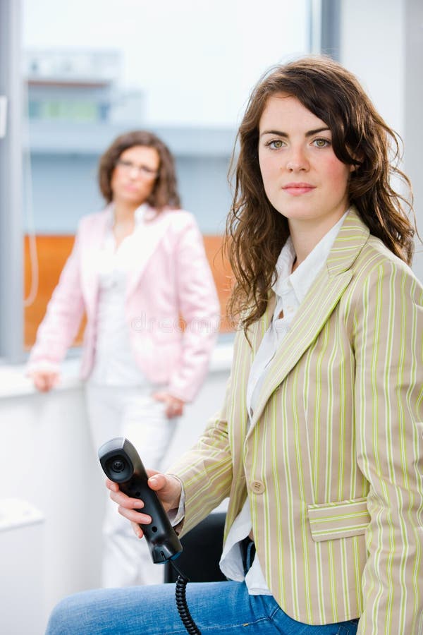Receptionist Calling On Phone Stock Photo - Image of attractive ...