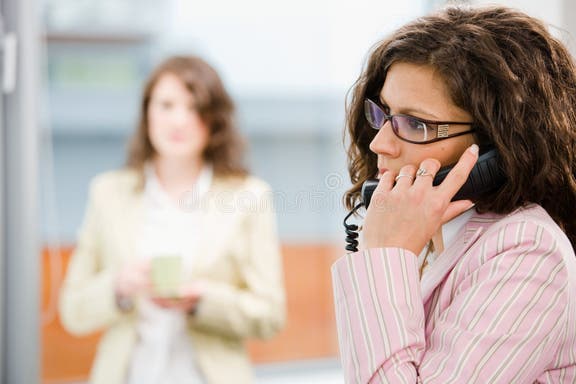 Receptionist Receiving Phone Calls Stock Image - Image of businesswomen ...