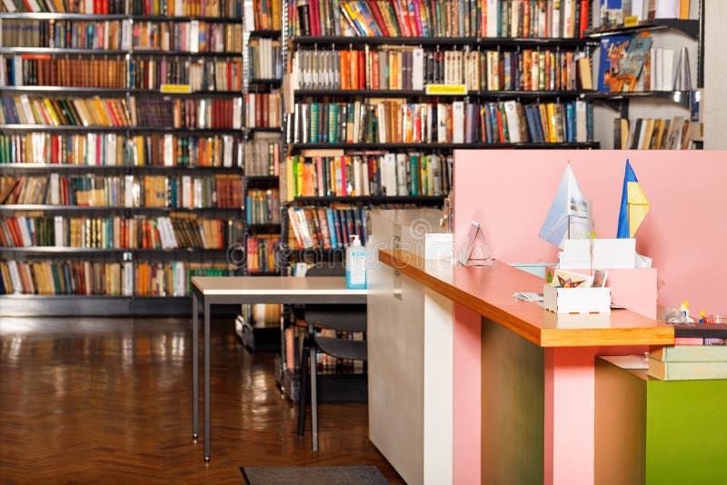 Receptionist in the Old Library on the Background of Bookshelves in ...