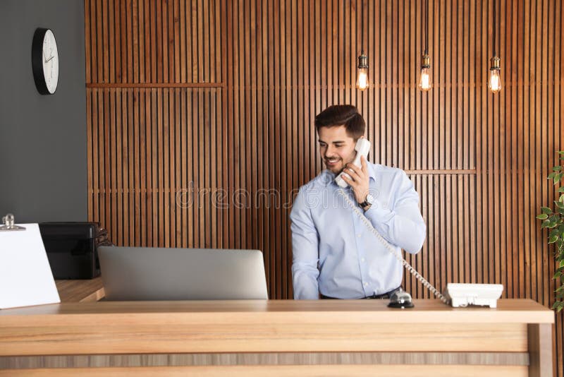 Receptionist Talking on Phone Stock Photo - Image of desk, corporation ...