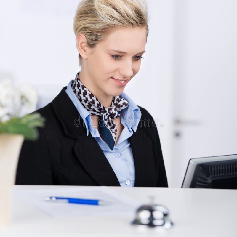 Receptionist Using Computer at Desk Stock Photo - Image of desktop ...