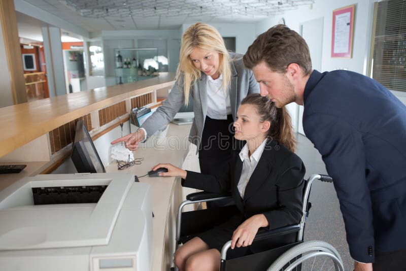 Receptionist Worker in Wheelchair Working on Computer Stock Photo ...