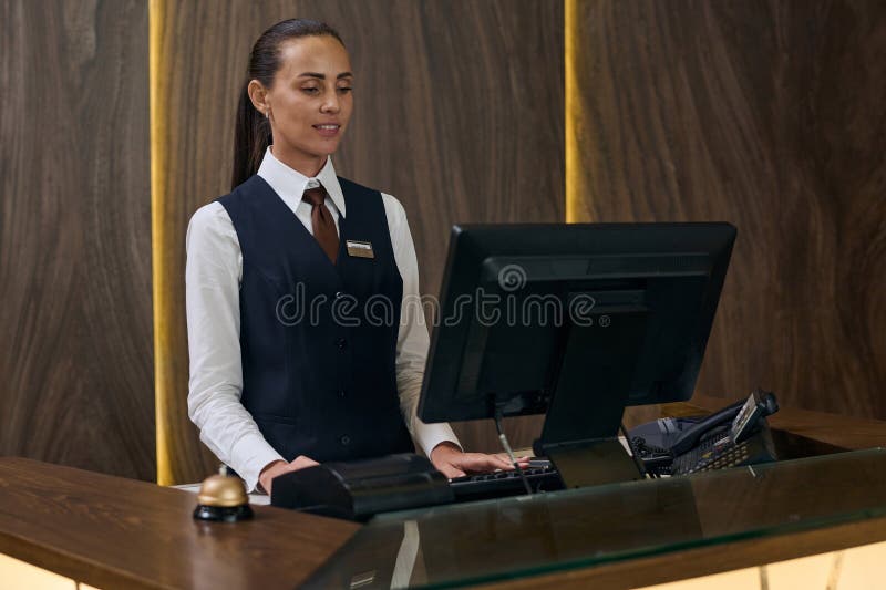 Receptionist Working on Computer in the Hotel Stock Photo - Image of ...