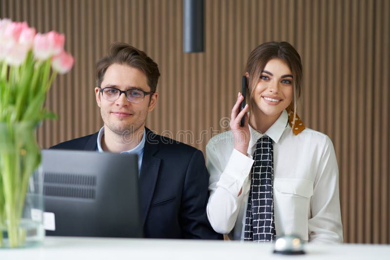 Receptionist Working in a Hotel Stock Image - Image of woman, counter ...