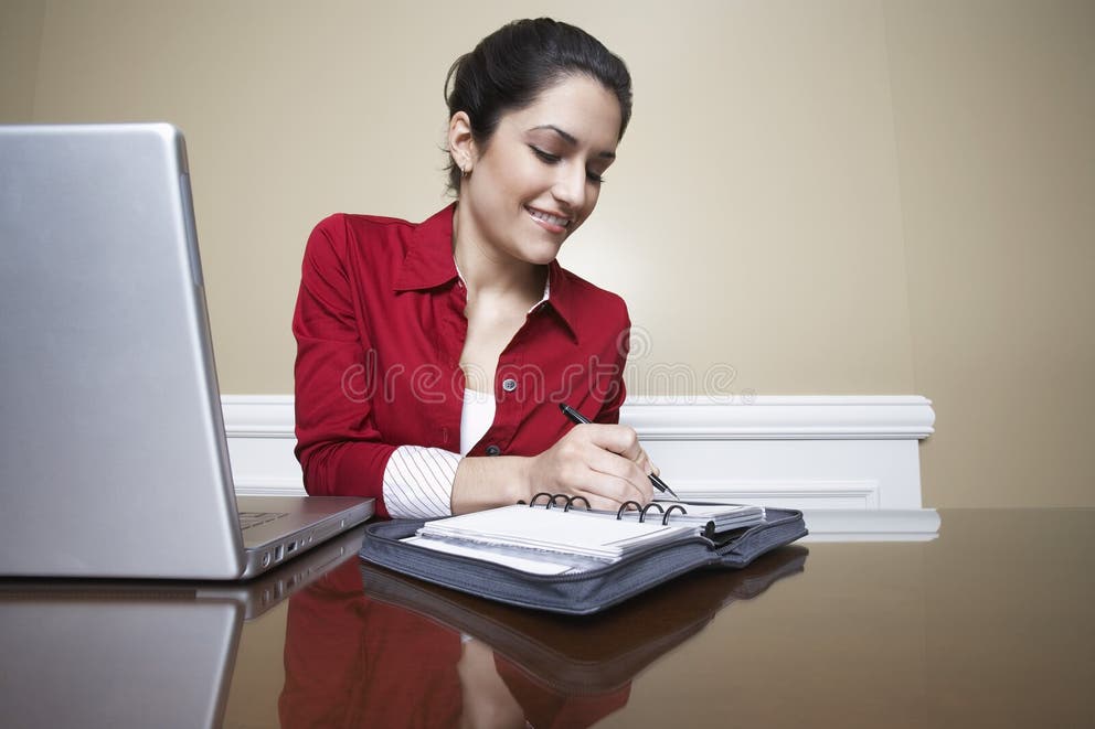 Receptionist Writing in Diary Stock Image - Image of office, notebook ...