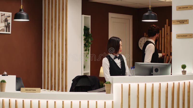 Receptionists Checking Appointments Stock Video - Video of desk, travel ...