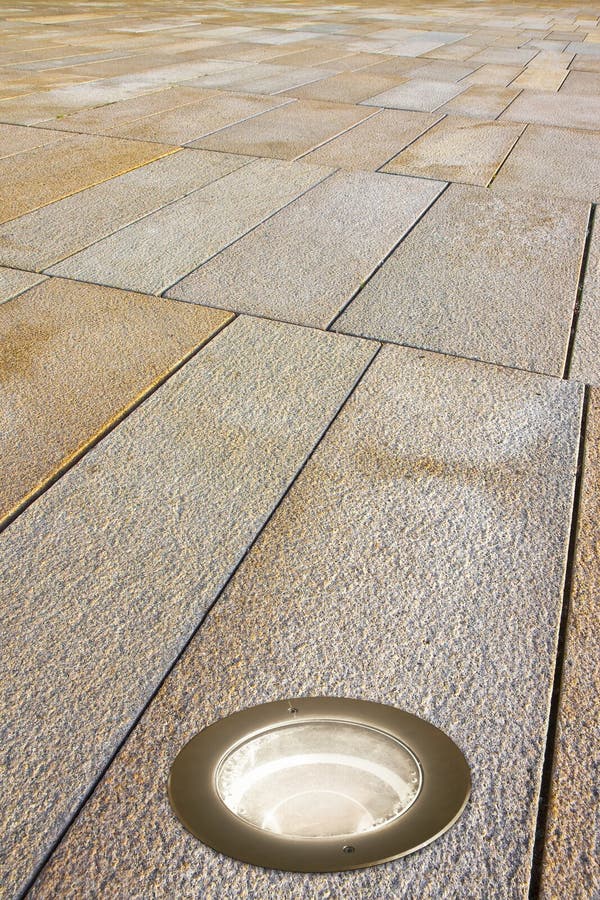 Recessed Floor Lamp on a Modern Stone Pavement Stock Image - Image of ...
