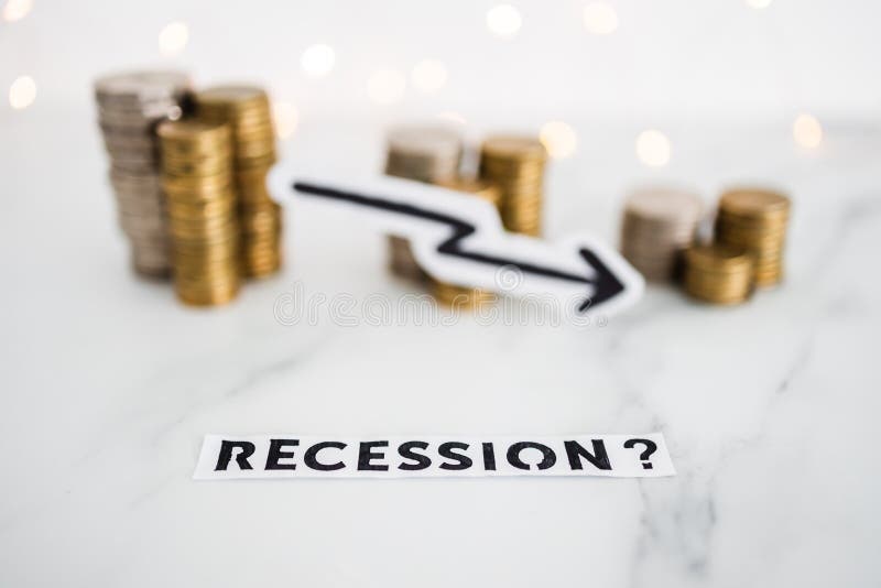Recession Text with Arrow Going Down in Front of Decreasing Stacks of ...