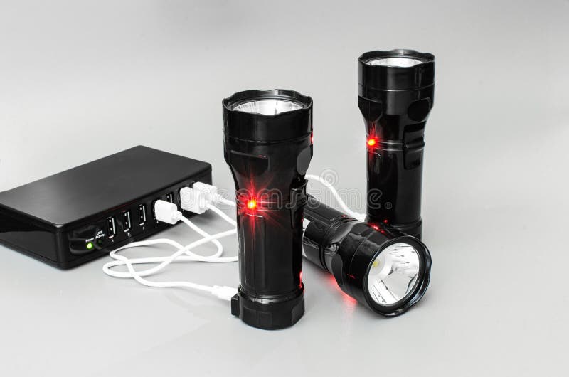 Rechargeable Flashlight Charging Via Power Stock Photo - Image of metal ...