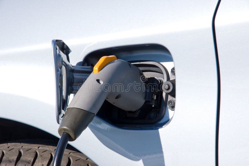 Recharging an electric car stock image. Image of outlet - 17042959
