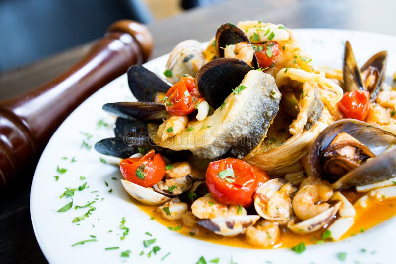 Breaded Hake Cooked with Mussels and Other Shellfish. Stock Photo ...