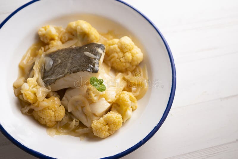 Cod Loins Cooked in the Oven with Onion and Cauliflower. Stock Image ...