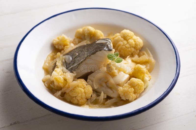 Cod Loins Cooked in the Oven with Onion and Cauliflower. Stock Photo ...