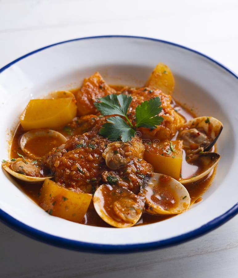 Cod Loins Cooked in the Oven with Tomato and Clams. Stock Photo - Image ...