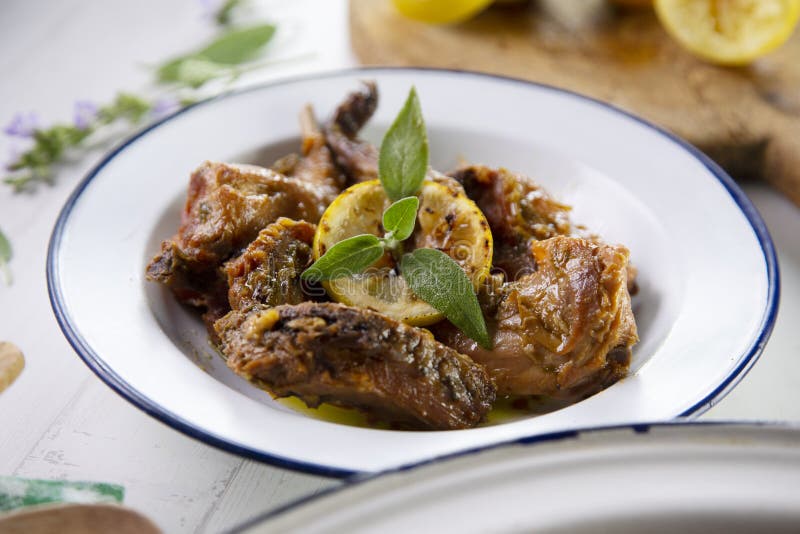 Fried Rabbit Cooked with Young Garlic and Sage. Typical Spanish Tapa ...