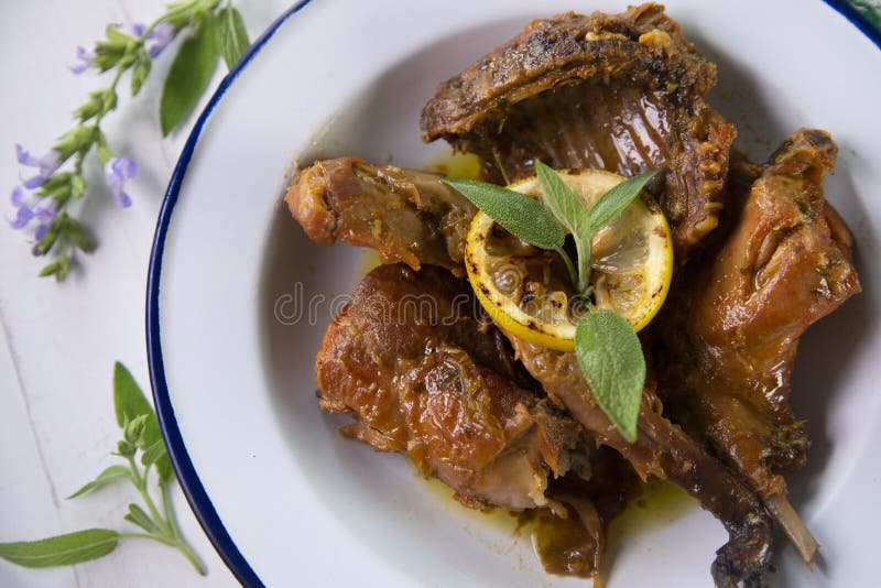 Fried Rabbit Cooked with Young Garlic and Sage. Typical Spanish Tapa ...
