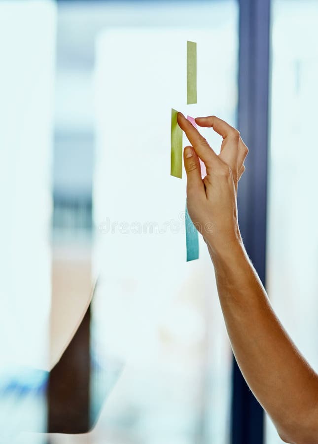 The Recipe for Success. a Woman Pasting Notes on Glass during a ...