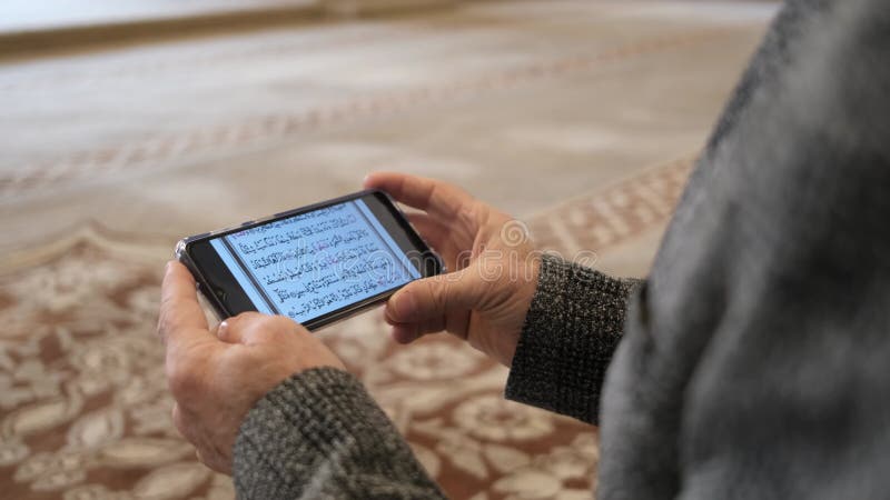 Reading Quran on Screen stock video. Video of pages - 245891507