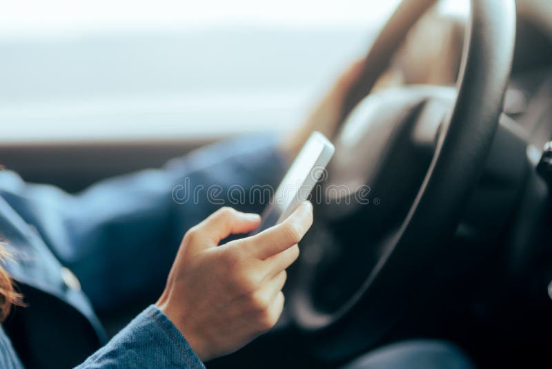 Irresponsible Driver Texting and Driving at the Same Time Stock Image ...