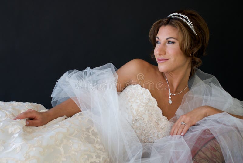 Reclining Bride with Happy Look on Face Stock Photo - Image of bride ...