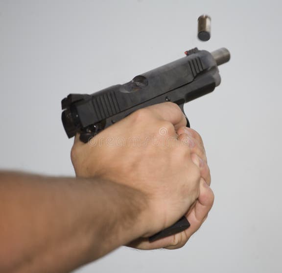 Recoiling handgun stock photo. Image of brown, hand, shell - 26755222
