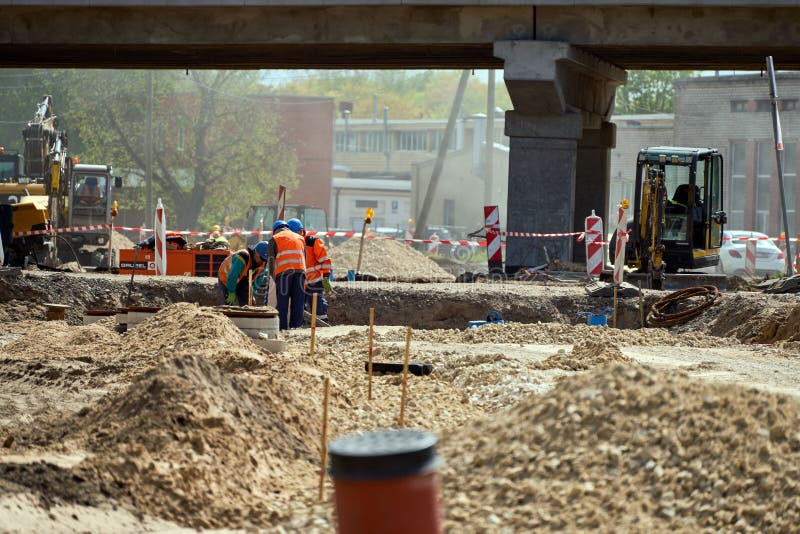 Reconstruction Site with Workers and Machines Under a Bridge Editorial ...