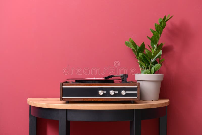 Record Player with Vinyl Disc on Table Near Color Wall Stock Image ...
