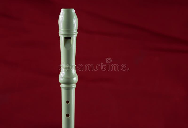 Recorder Instrument Against a Mottled Red Background Stock Photo ...