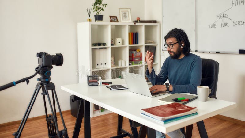 Recording Video Tutorial about HTML. Professional Male Computer ...