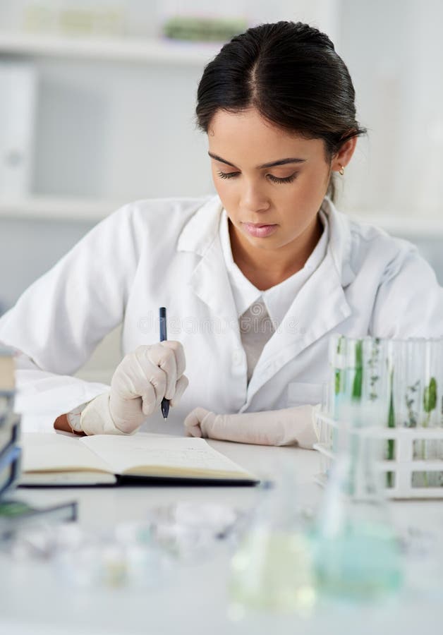 Recording What she Has Observed. a Young Scientist Writing Notes while ... Recording What she Has Observed. a Young Scientist Writing Notes while ...