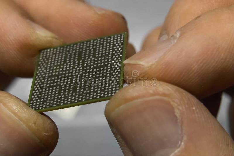 Recovered Computer Microprocessor Chip is in the Hands of a Man Stock ...