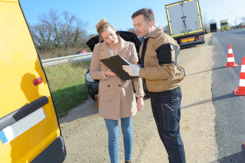 Recovery Driver Asking Customer To Sign Paperwork Stock Photo - Image ...